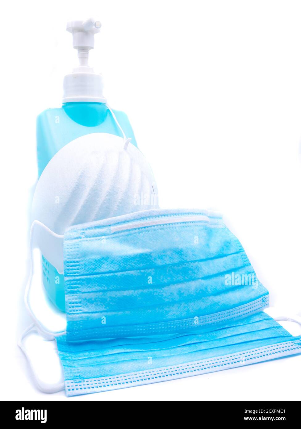 Disinfectants and masks isolated on white background Stock Photo - Alamy