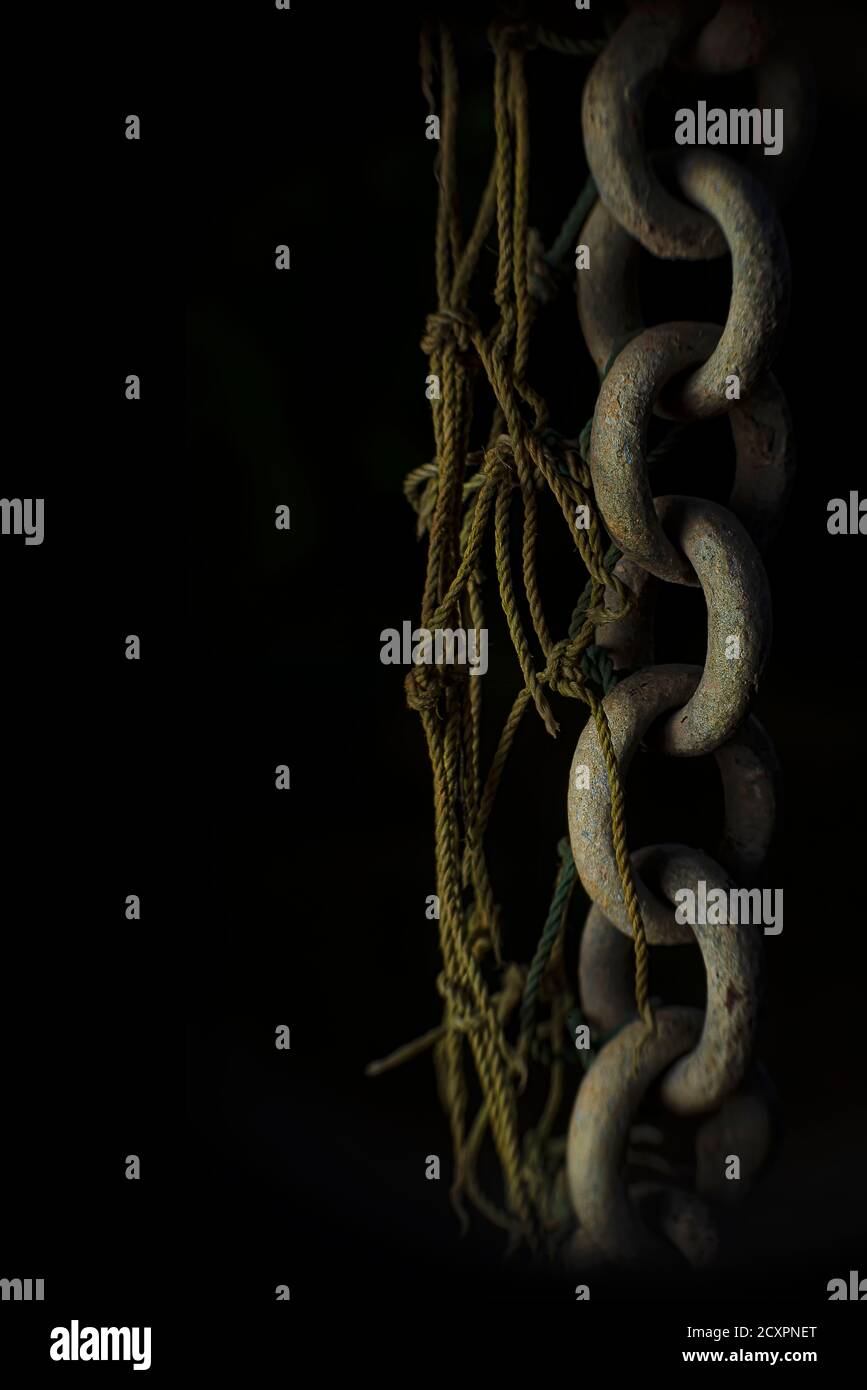 rust chain in a black background Stock Photo - Alamy