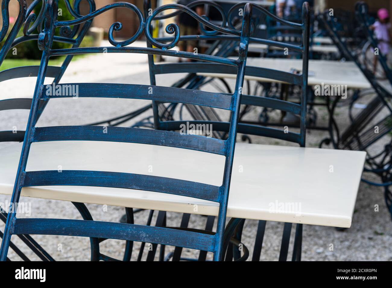 Close up of an empty table with empty chairs at a local outdoor ...