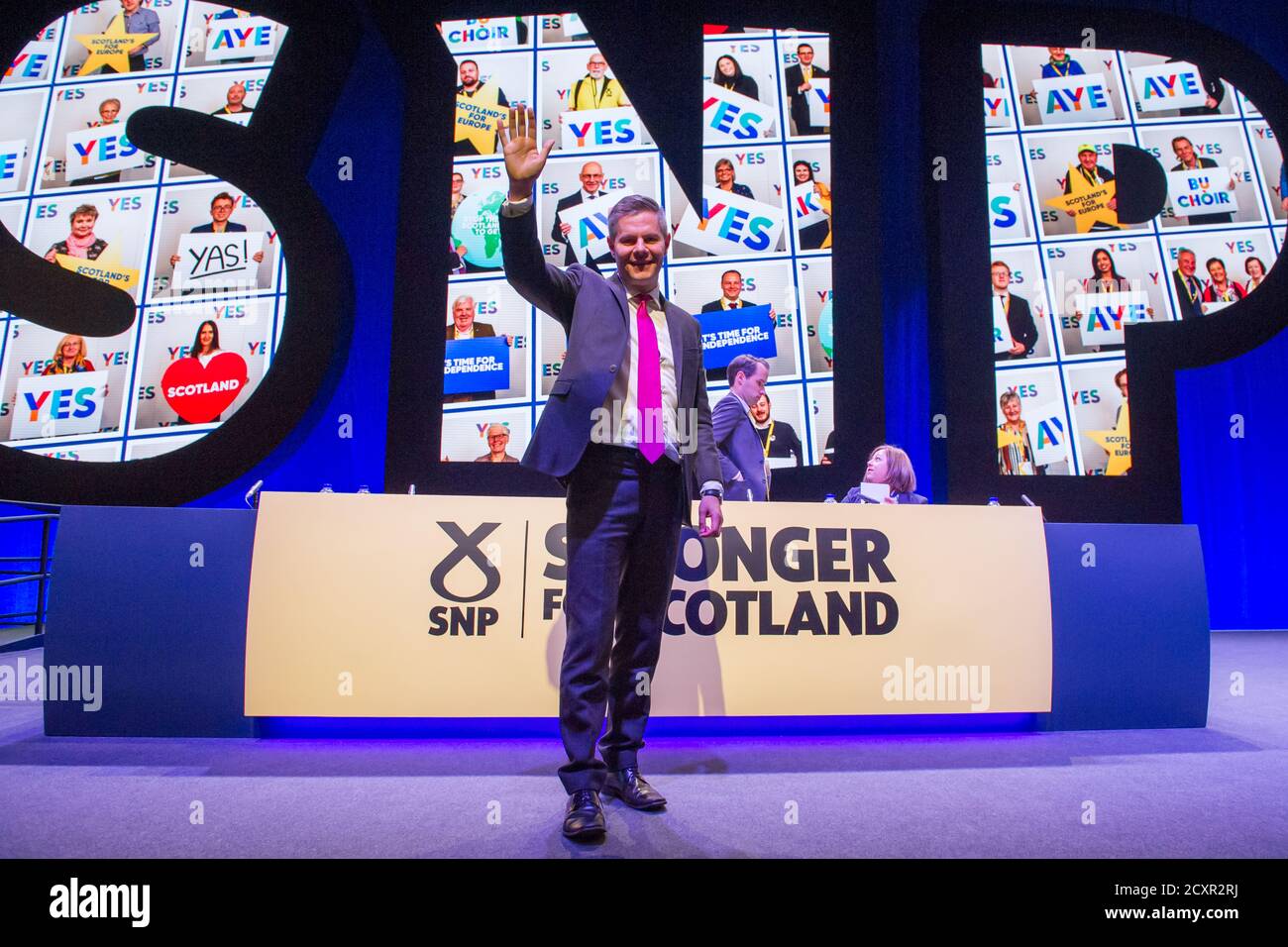 Derek mackay waves with snp backdrop big letters hi-res stock ...