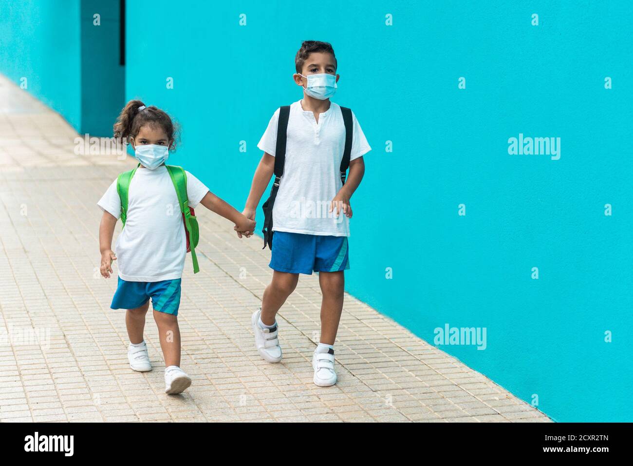 Children with face mask going back to school during coronavirus ...