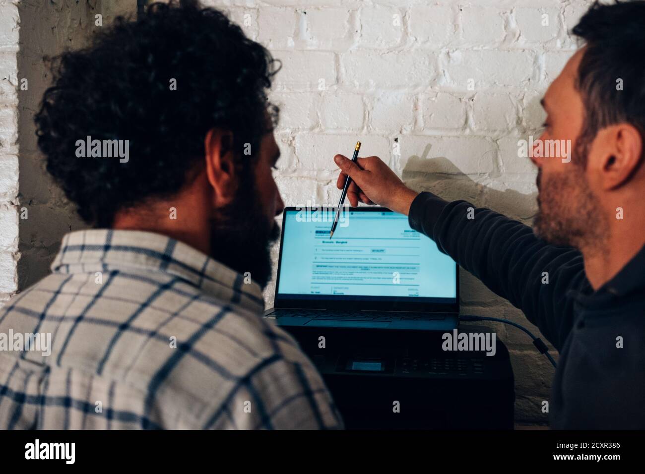 Two men with laptop computer hi-res stock photography and images - Alamy