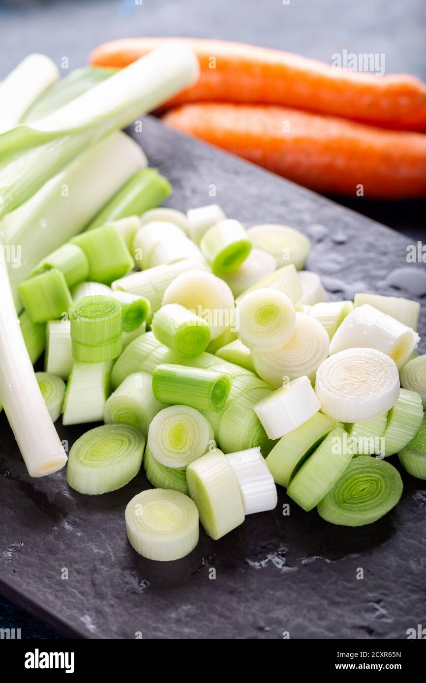 Washed sliced leek. sliced leek on stone cutting board Stock Photo - Alamy