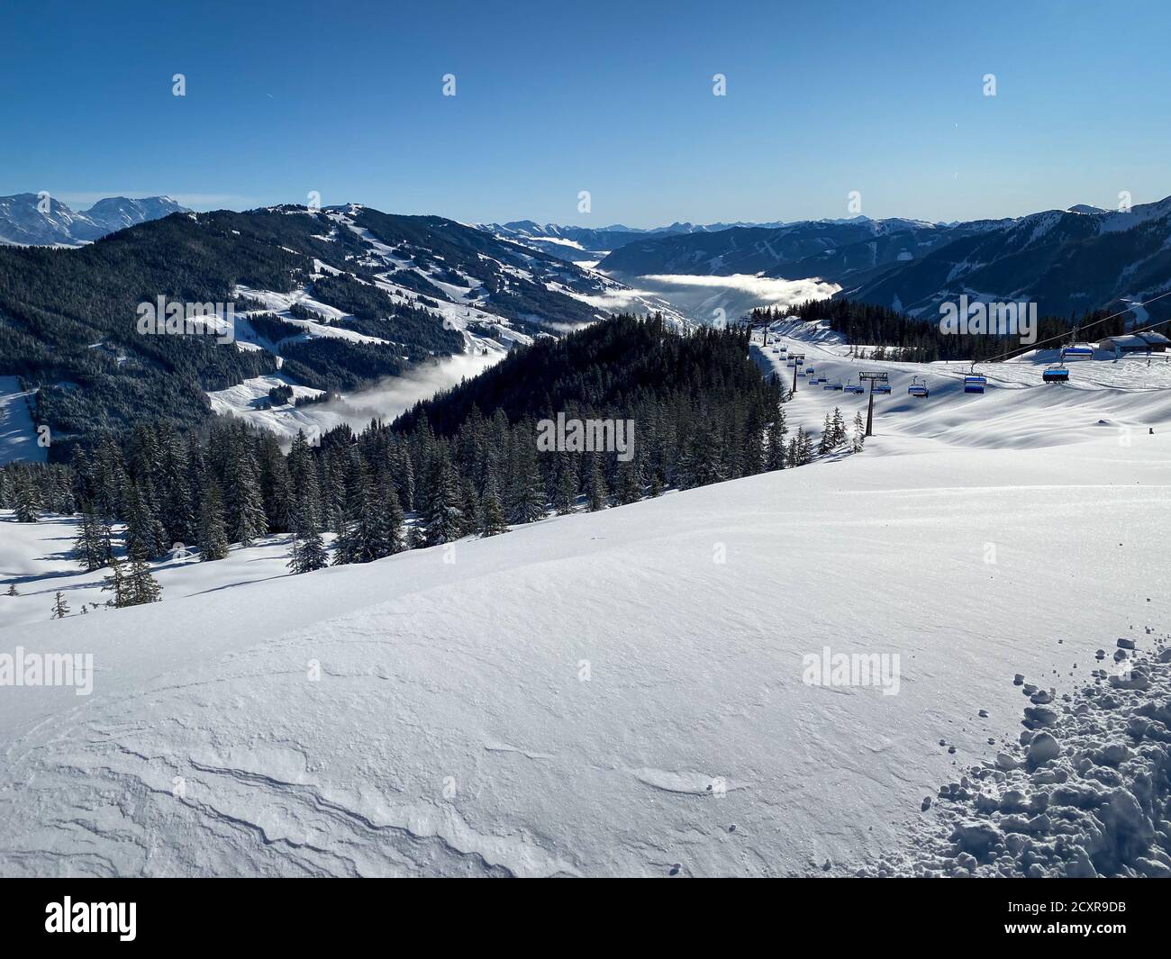 Panoramic view of snow covered mountains in the ski region of Saalbach ...
