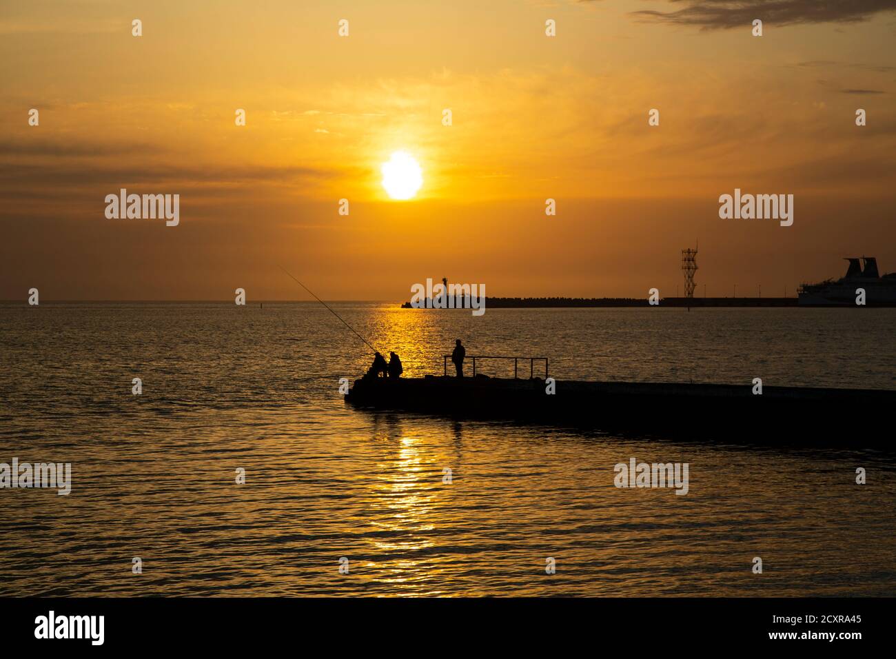 Silhouette father son fishing sunset hi-res stock photography and ...