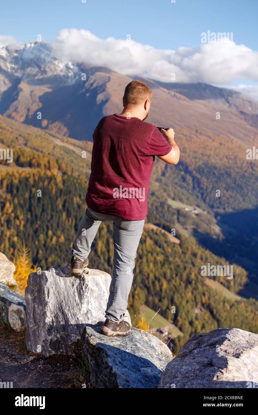 man making a photo shoot beautiful landscape the camera Stock Photo - Alamy