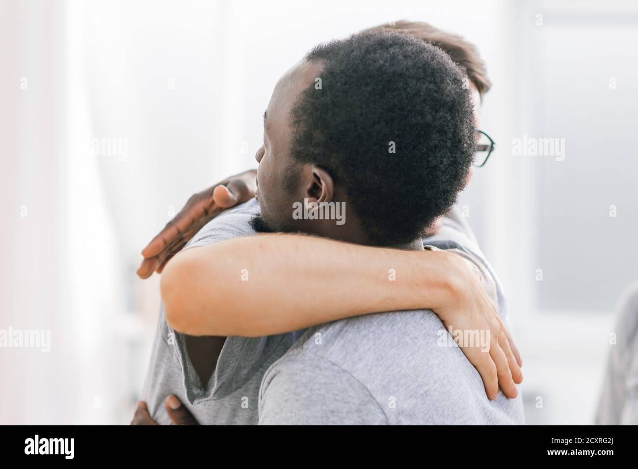 two happy student friends hugging each other Stock Photo - Alamy