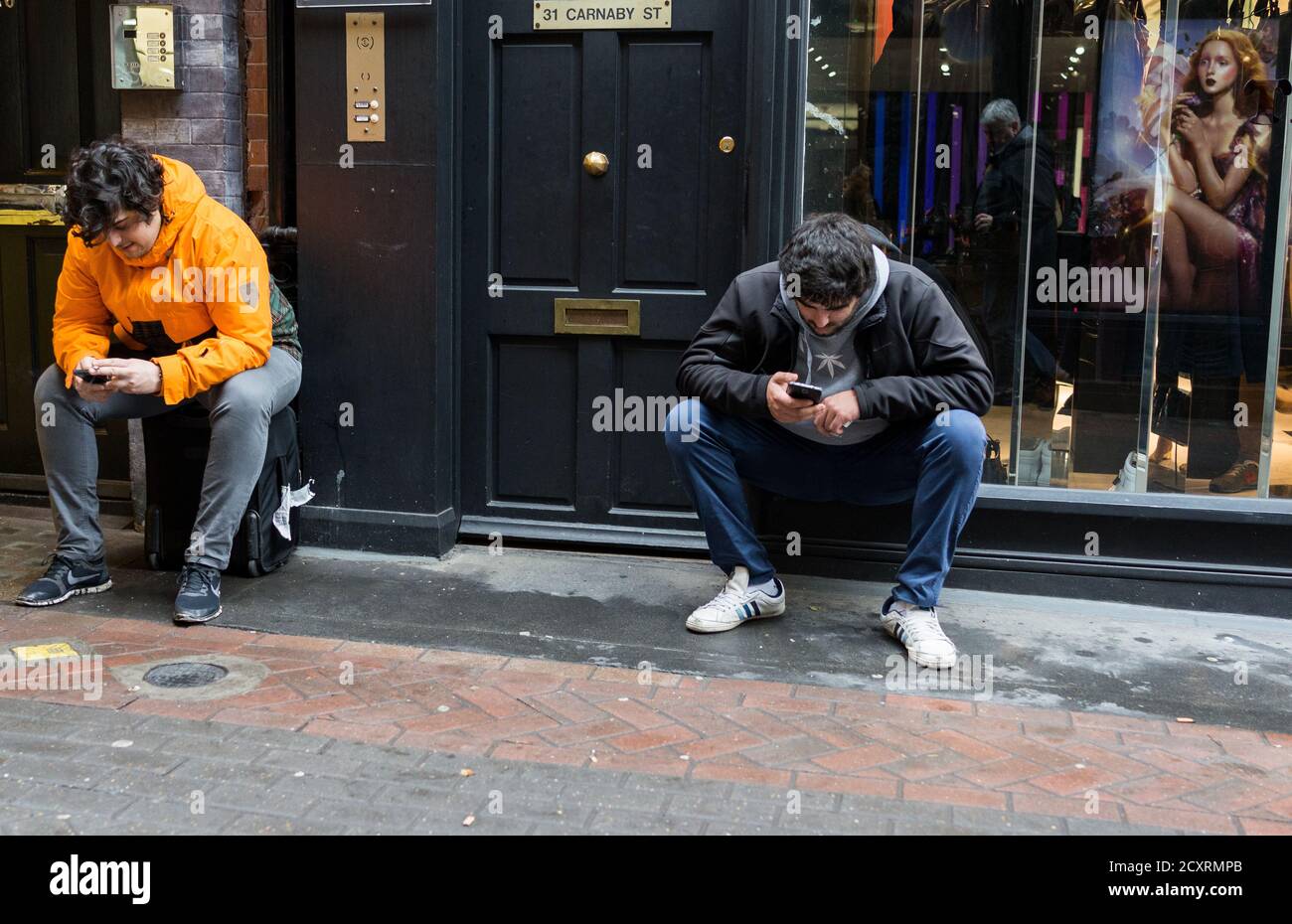 Pedestrians Using Mobile Phones High Resolution Stock Photography and ...