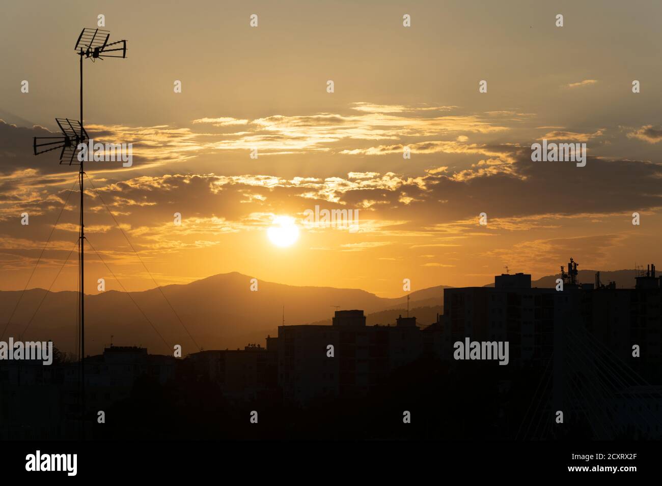 a beautiful golden sunset close up with the sun just about to go behind ...