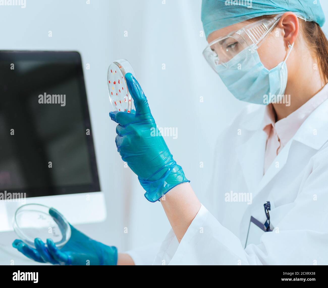 female microbiologist conducts research in the laboratory Stock Photo ...