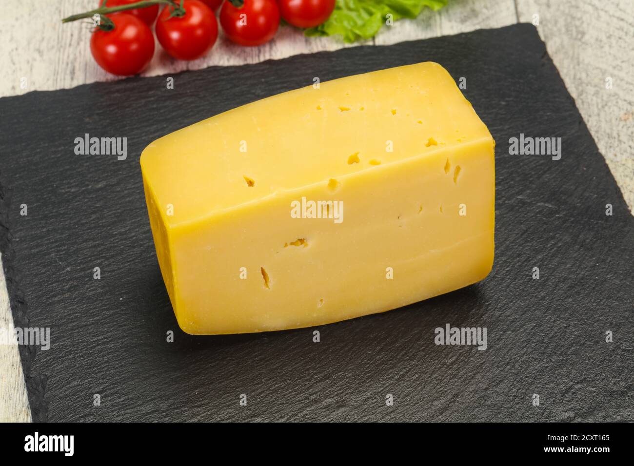 Swiss Hard yellow tasty cheese brick Stock Photo - Alamy