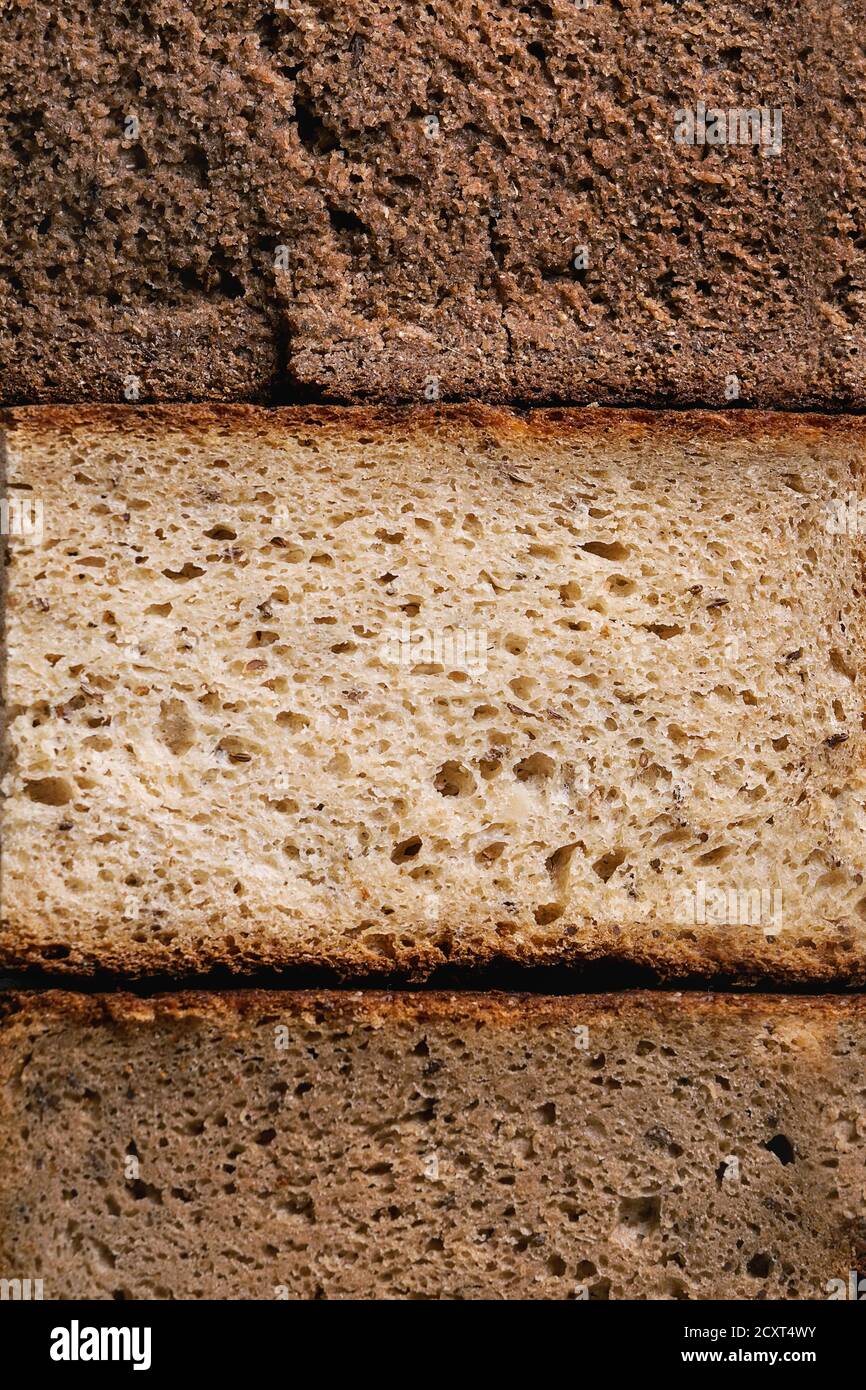 Variety loaves of sliced homemade rye bread whole grain. Top view ...