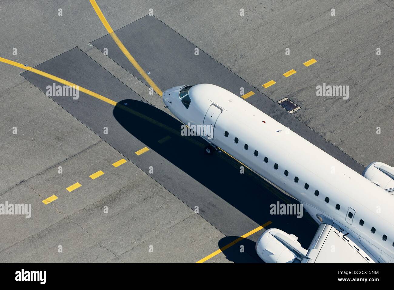 Aerial view of airport. Airplane taxiing to runway before take off ...