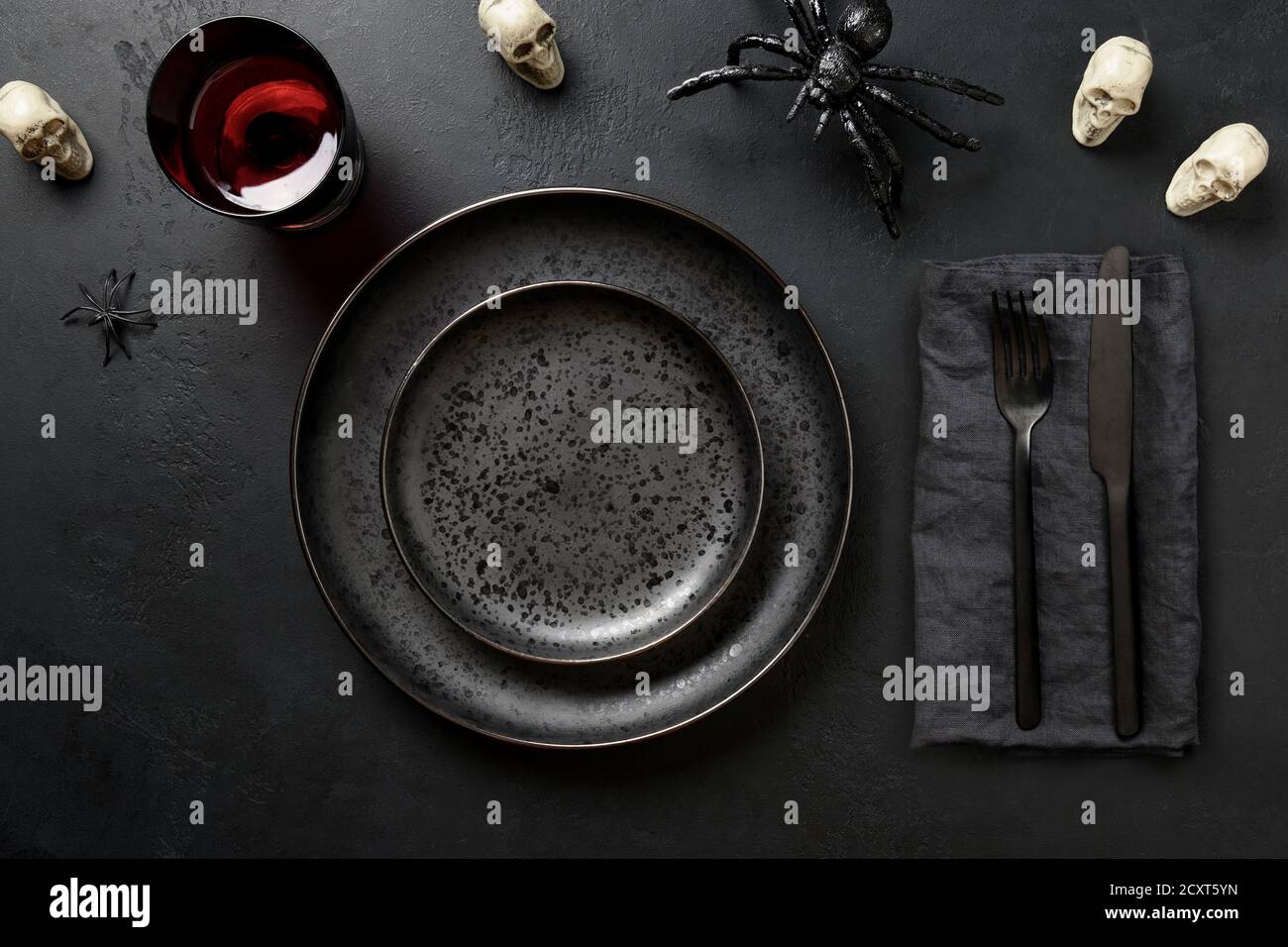 Halloween table setting decorated skulls, spiders and horror party ...