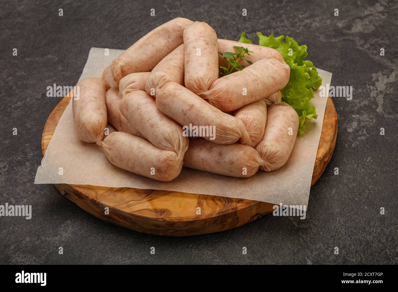 Raw natural chicken baby sausages for roast Stock Photo - Alamy