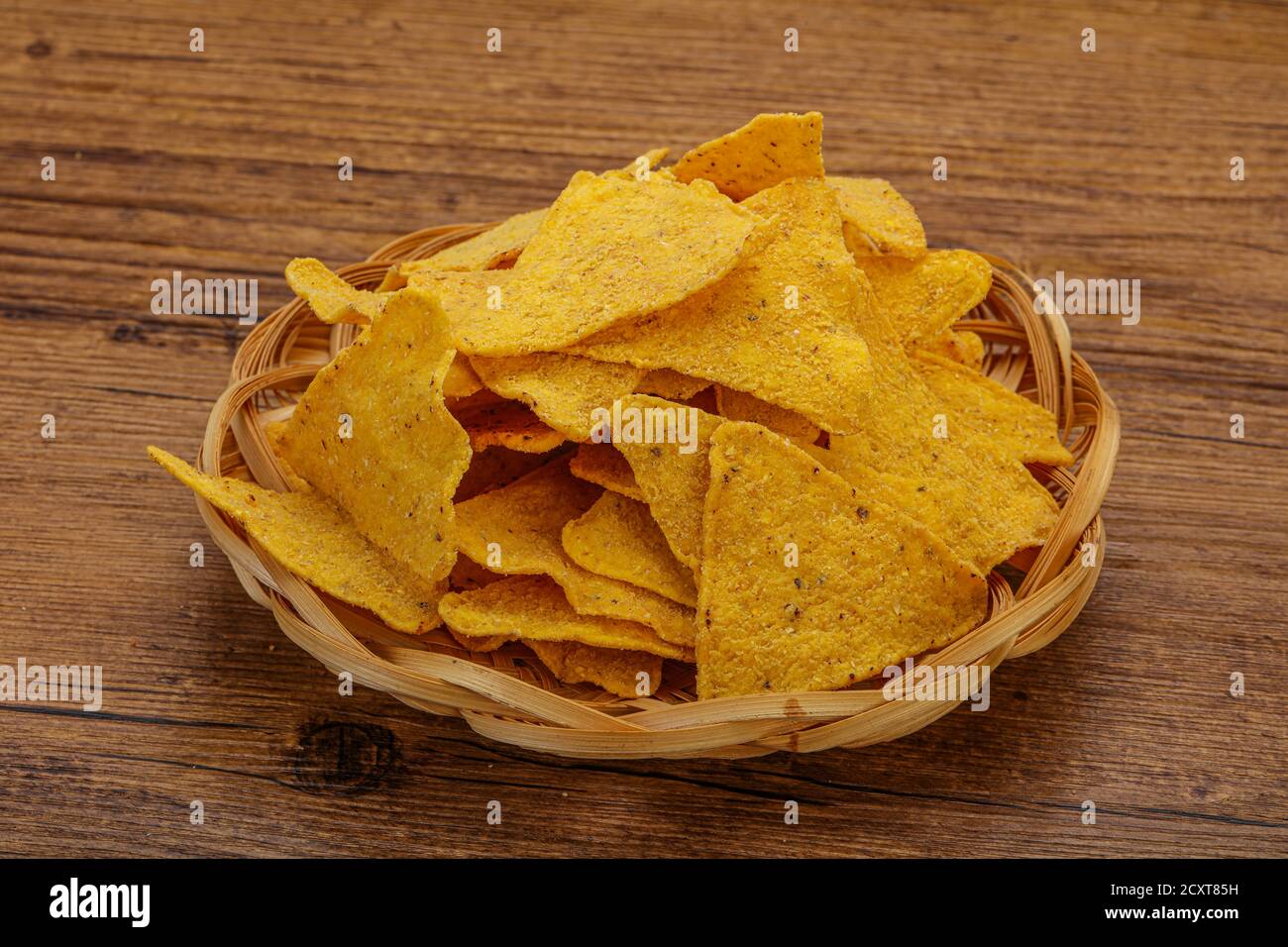 Mexican crunchy corn nachos triangle heap Stock Photo - Alamy