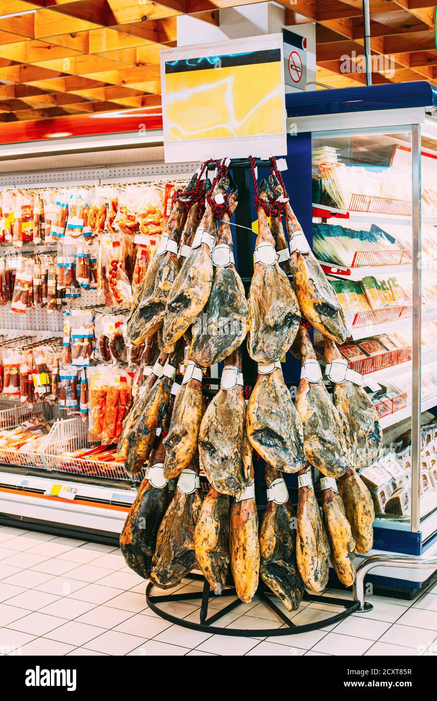 Hanging Jamon meat in shop. Spanish ham an important part of Spanish ...