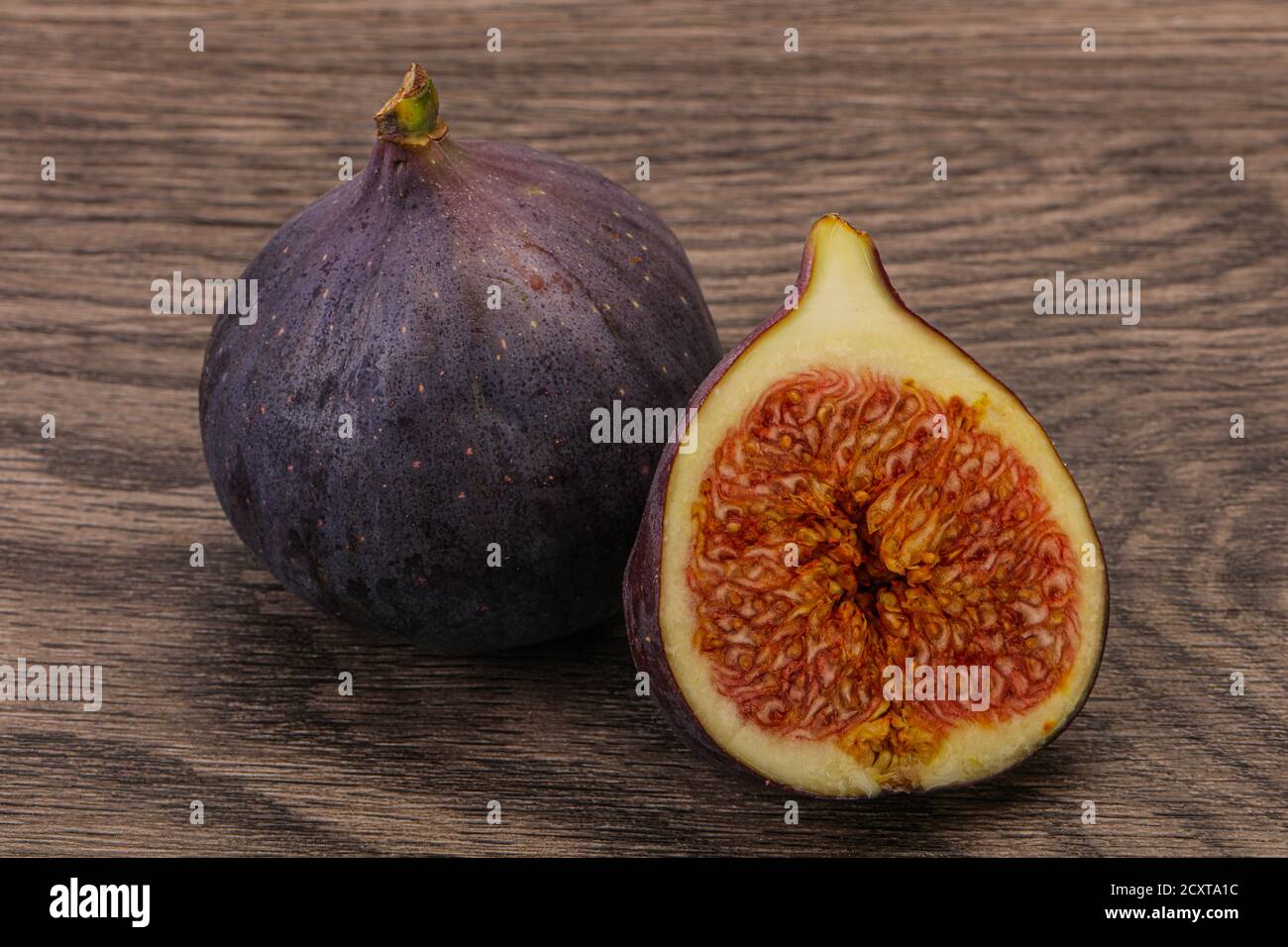 Sweet purple slice of fig fruit Stock Photo - Alamy