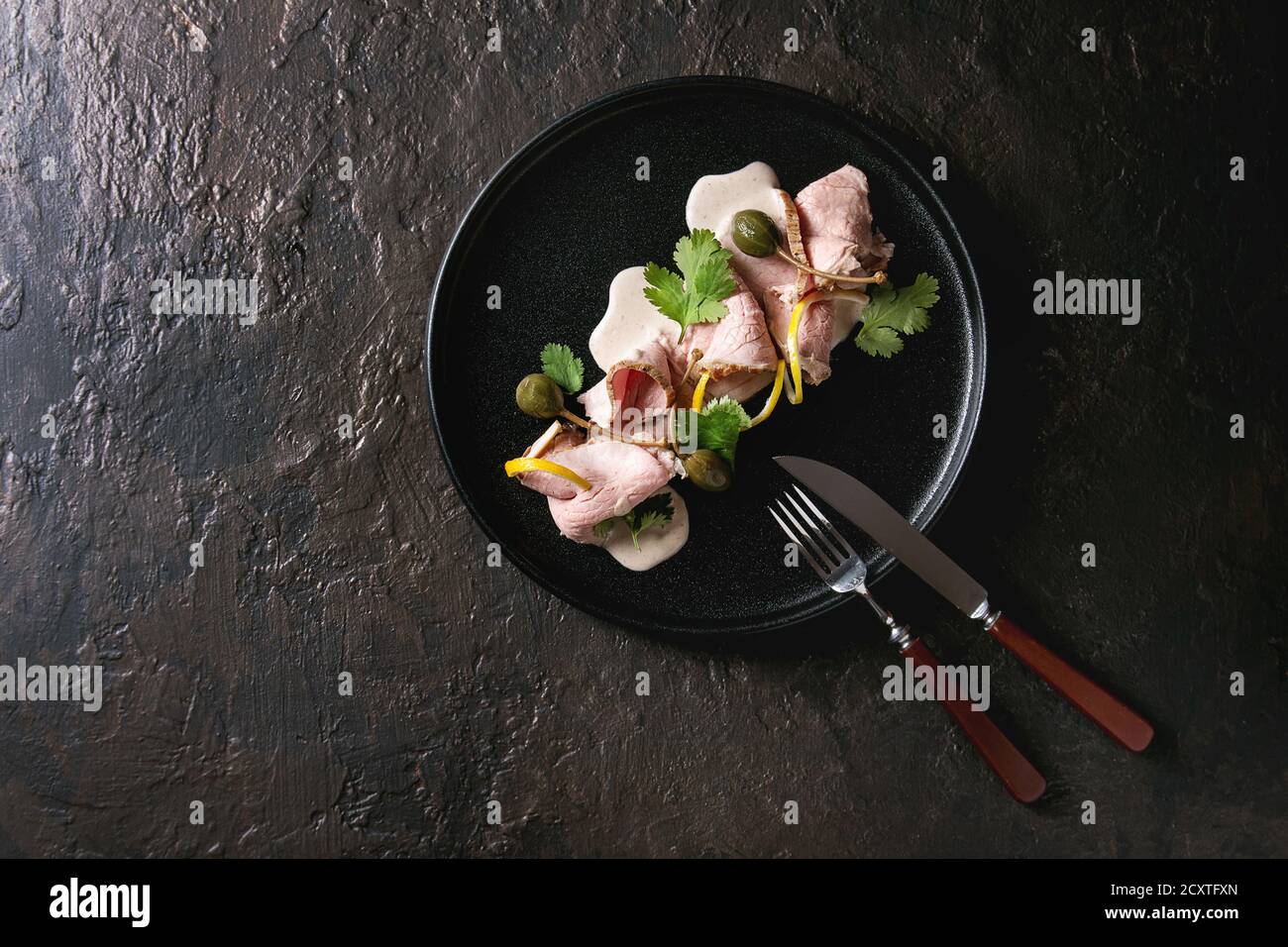 Vitello tonnato italian dish. Thin sliced veal with tuna sauce, capers ...