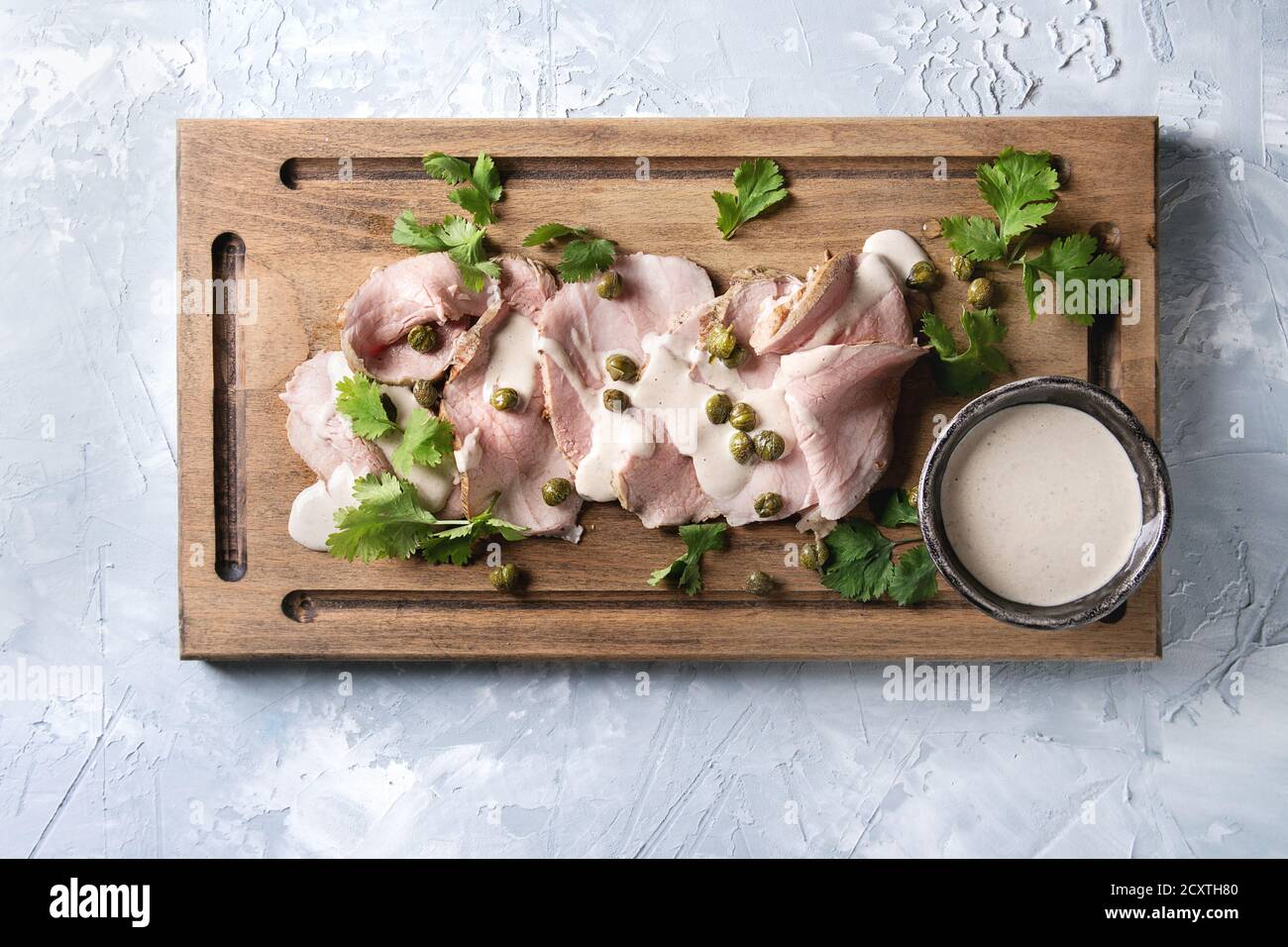 Vitello tonnato italian dish. Thin sliced veal with tuna sauce, capers ...