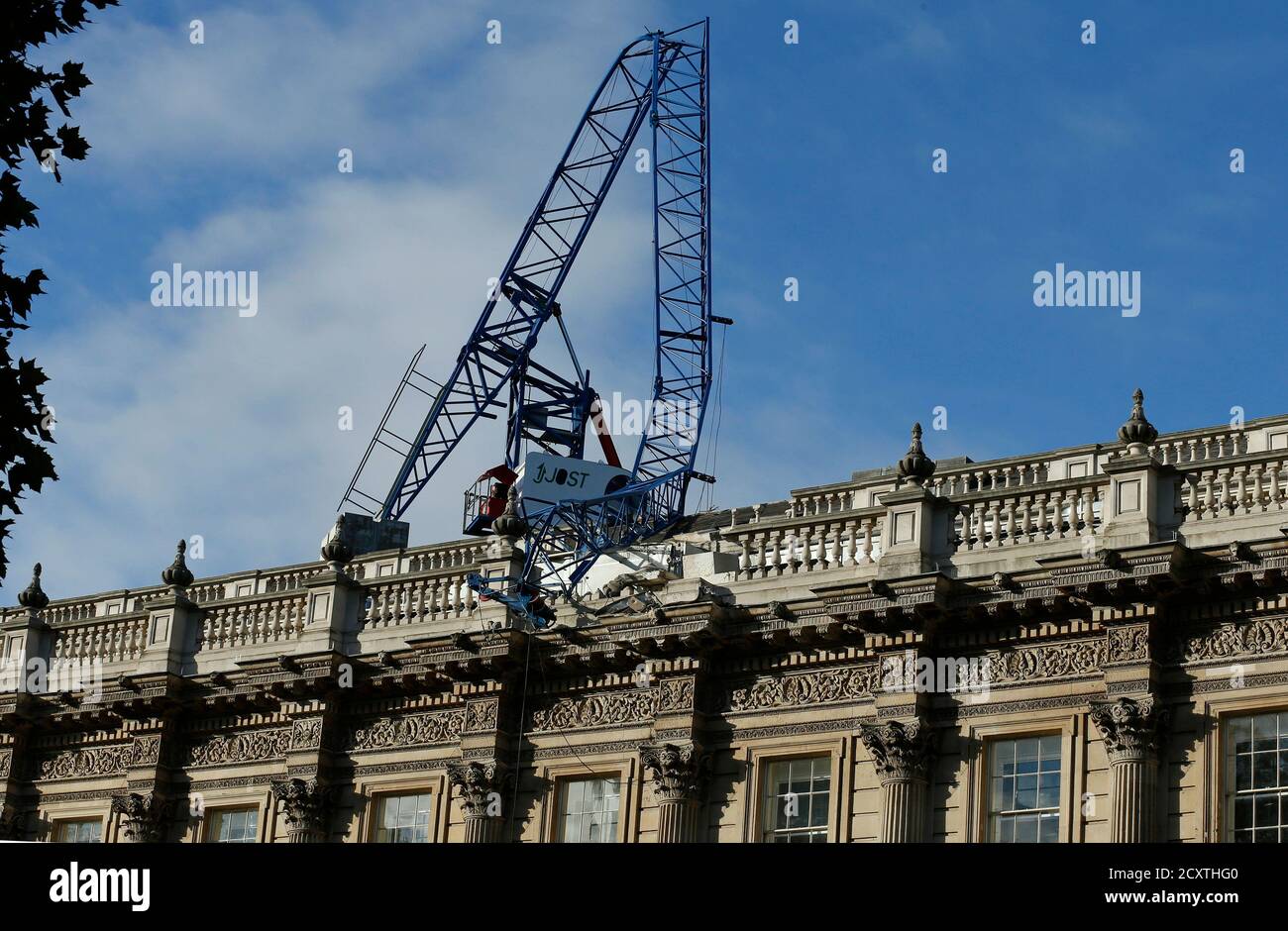 A collapsed crane on the roof of the cabinet office hi-res stock ...