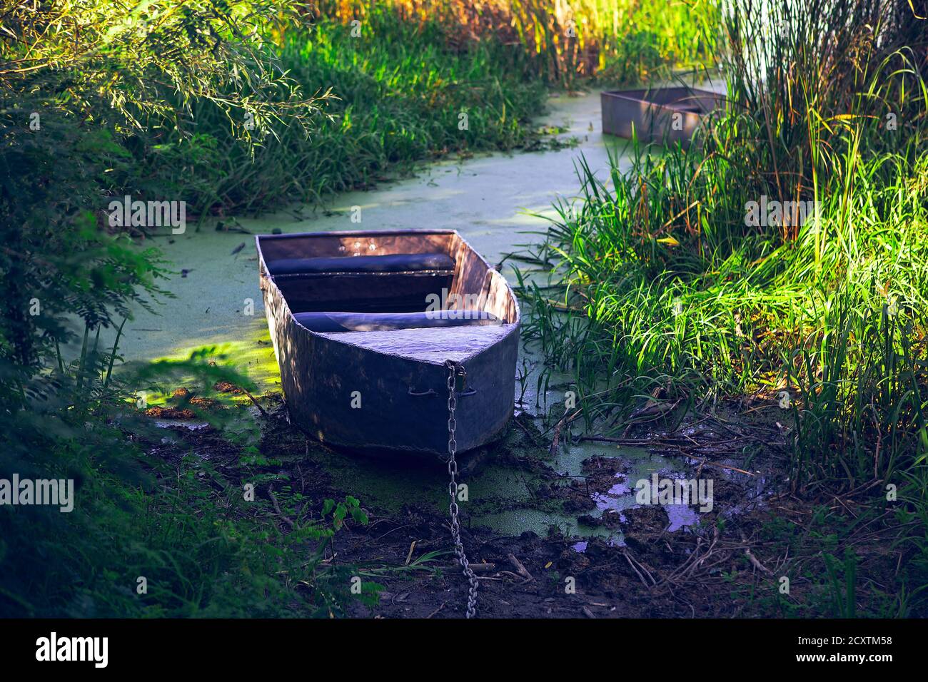 old fishing boat on the dirty shore Stock Photo - Alamy