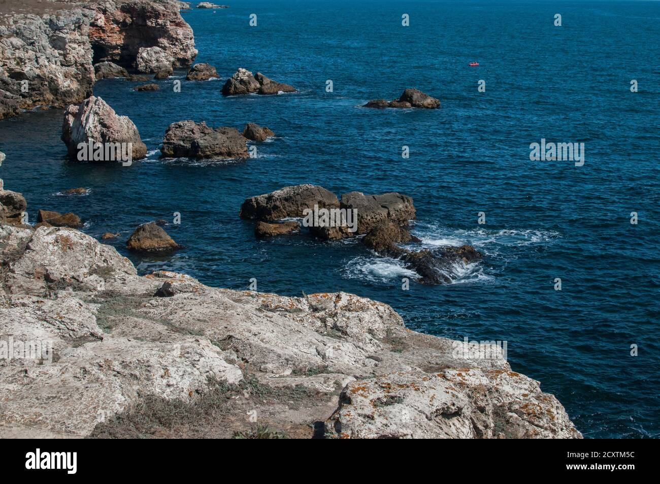 Summer sea shore landscape with blue waters and coastal rocks Stock ...
