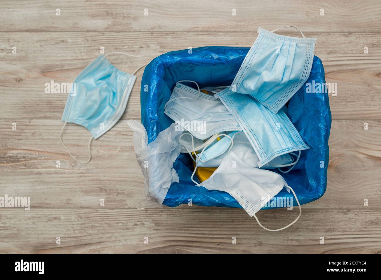 Used and contaminated surgical masks in the waste bin Stock Photo - Alamy
