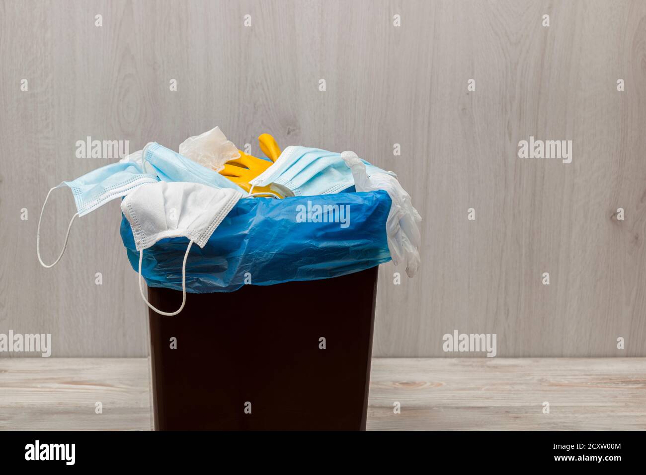 Used and contaminated surgical masks in the waste bin Stock Photo - Alamy