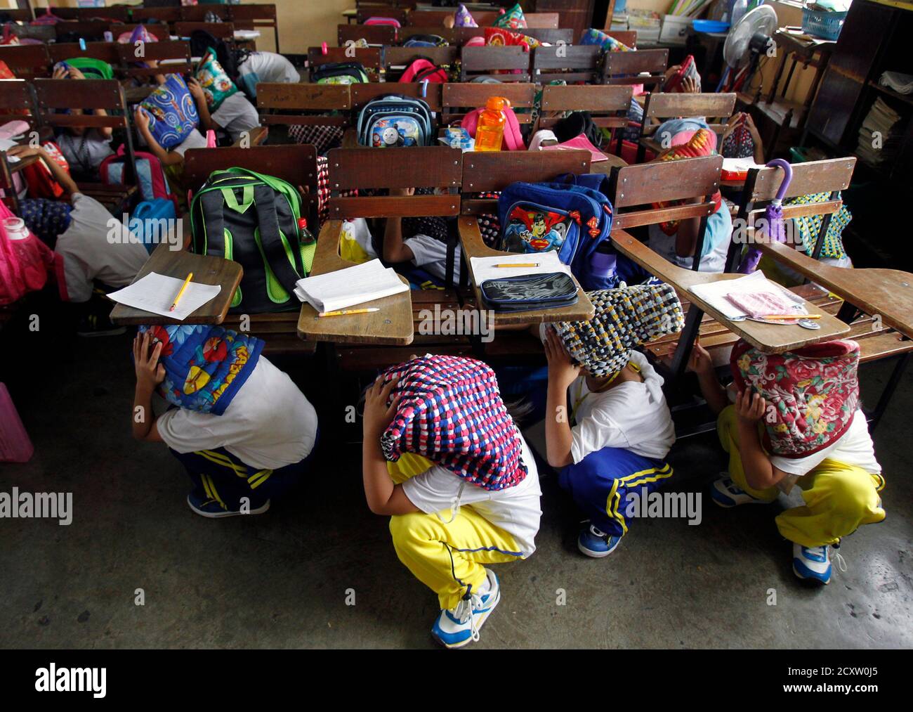Head during earthquake drill hi-res stock photography and images - Alamy