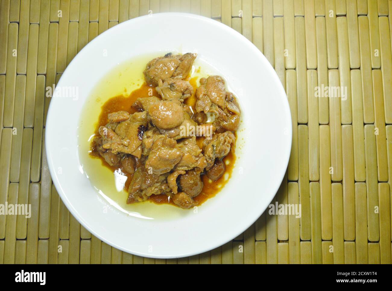 fried chicken with sweet soy sauce on dish Stock Photo - Alamy