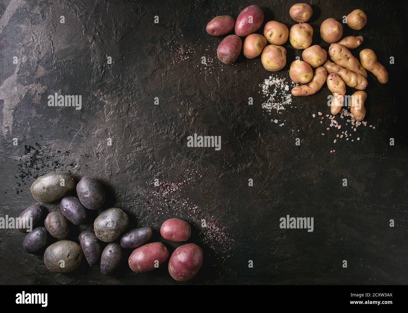 Variety of raw uncooked organic potatoes different kind and colors red ...