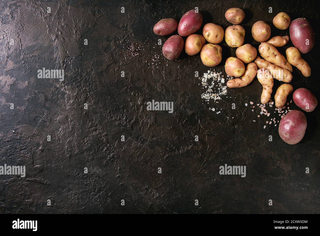 Variety of raw uncooked organic potatoes different kind and colors red ...