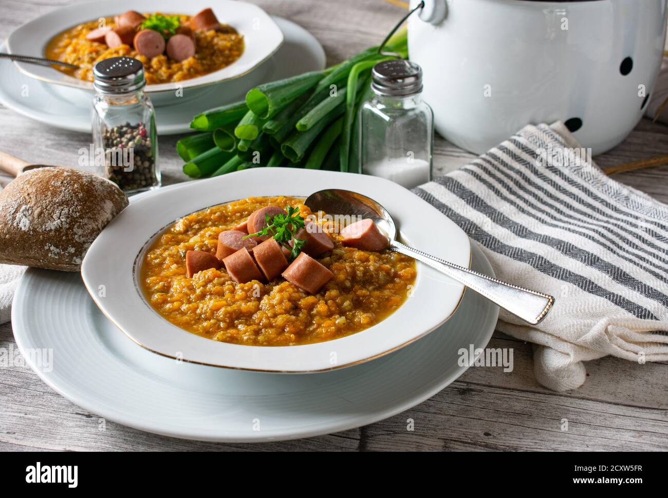 a plate of vegetable stew with hot dogs Stock Photo - Alamy