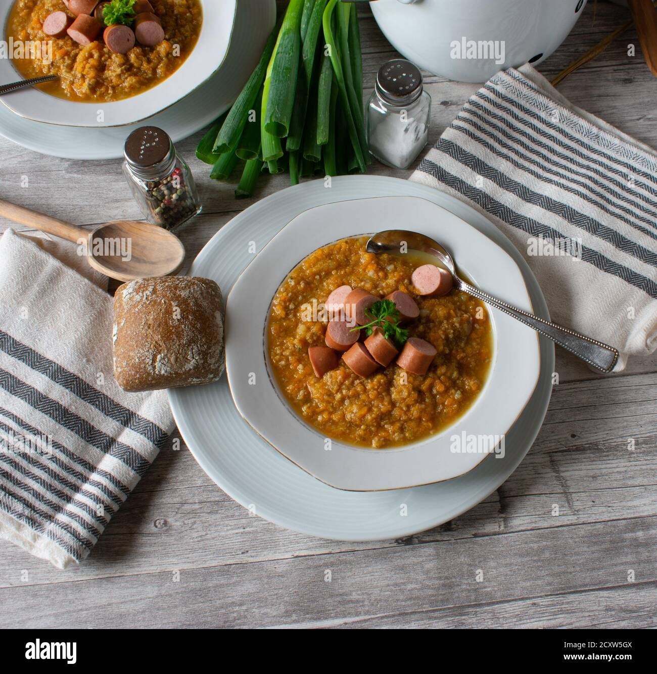 a plate of vegetable stew with hot dogs Stock Photo - Alamy