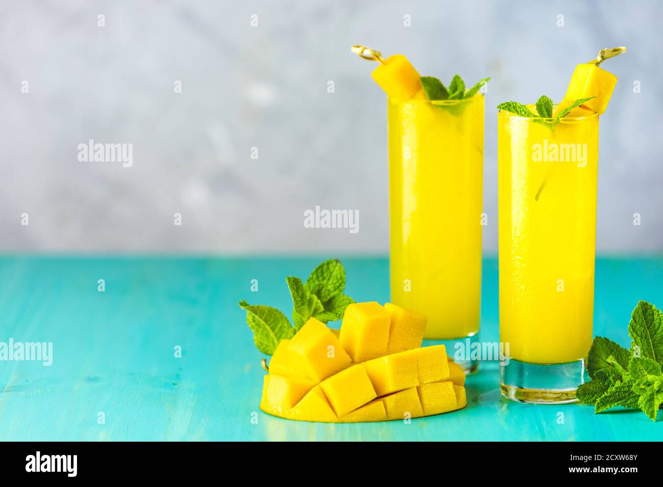 Refreshing summer cocktails made of mango, cold drink or a drink with ...