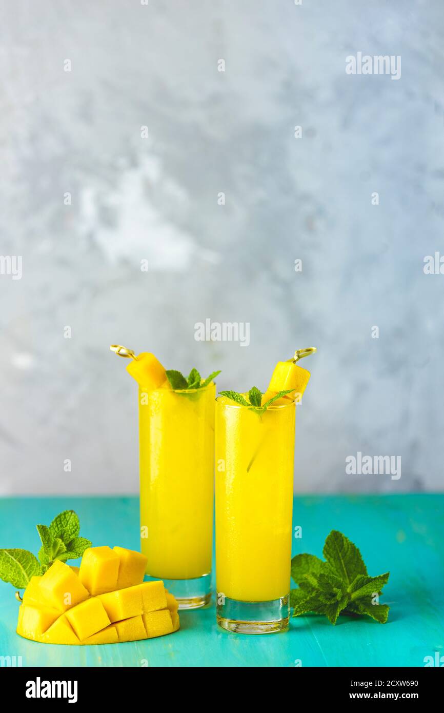 Refreshing summer cocktails made of mango, cold drink or a drink with ...