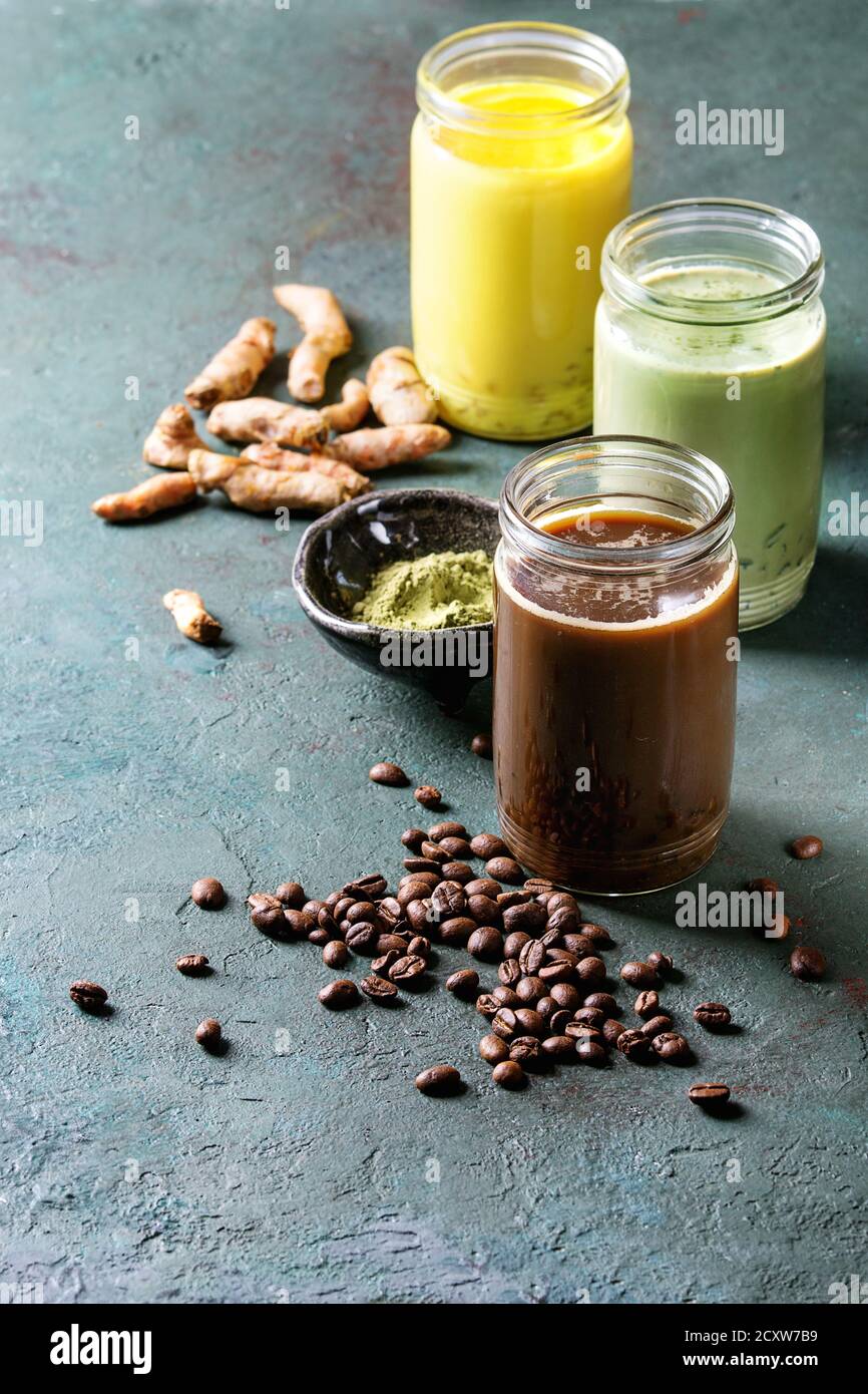 Variety of iced colorful latte drinks. Iced coffee, turmeric and matcha ...