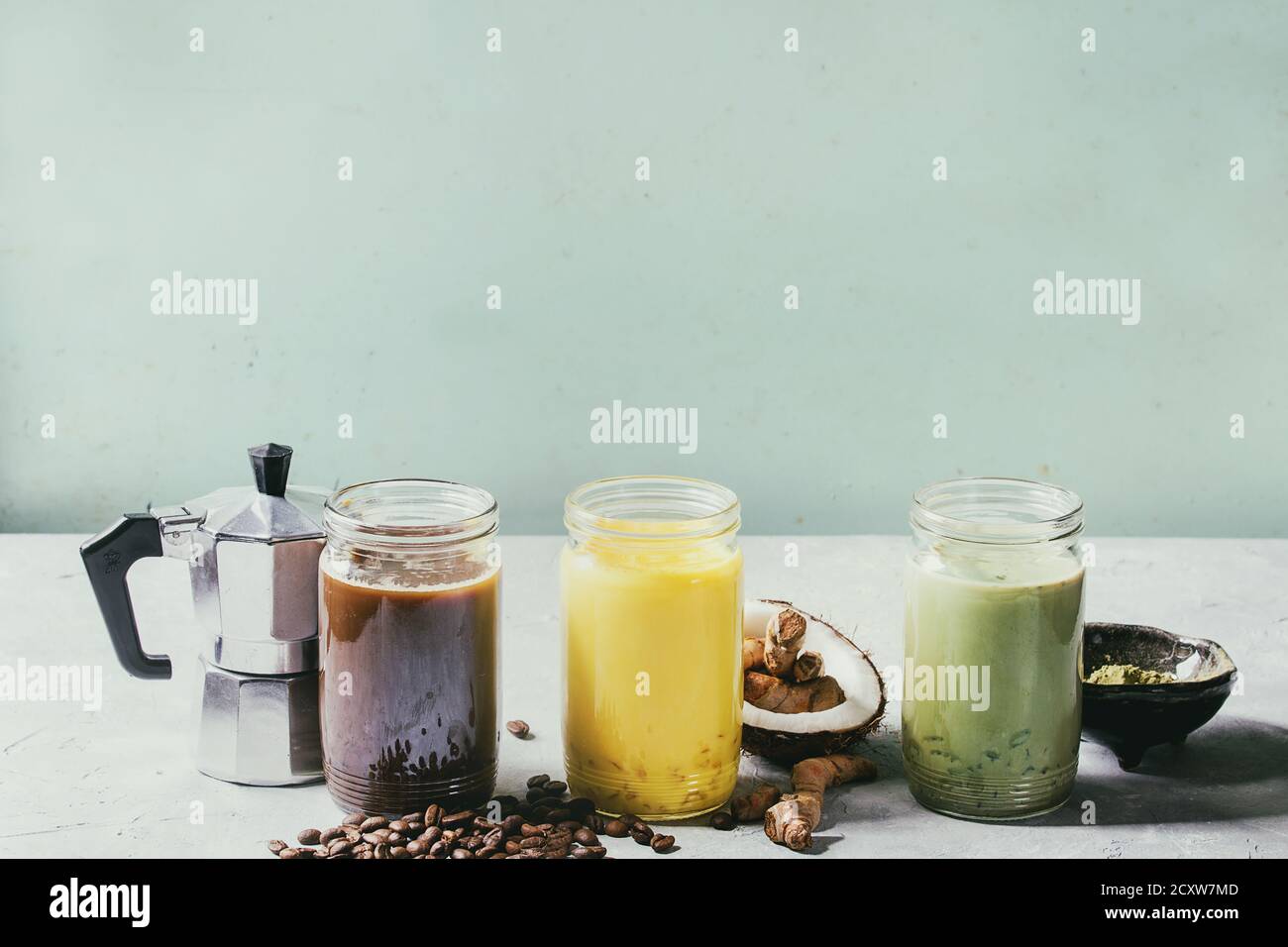 Variety of iced colorful latte drinks. Iced coffee, turmeric and matcha ...