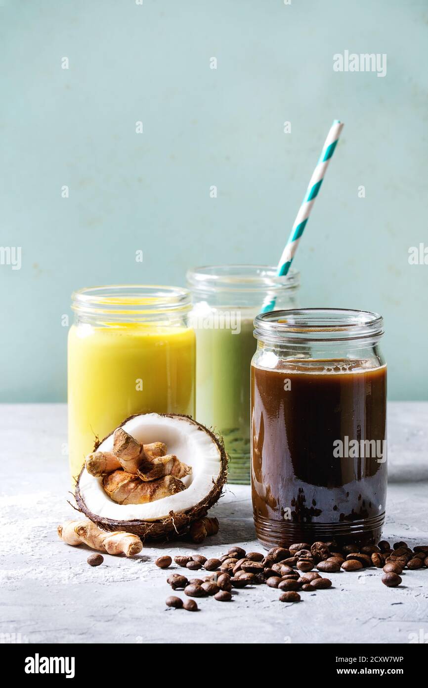 Variety of iced colorful latte drinks. Iced coffee, turmeric and matcha ...