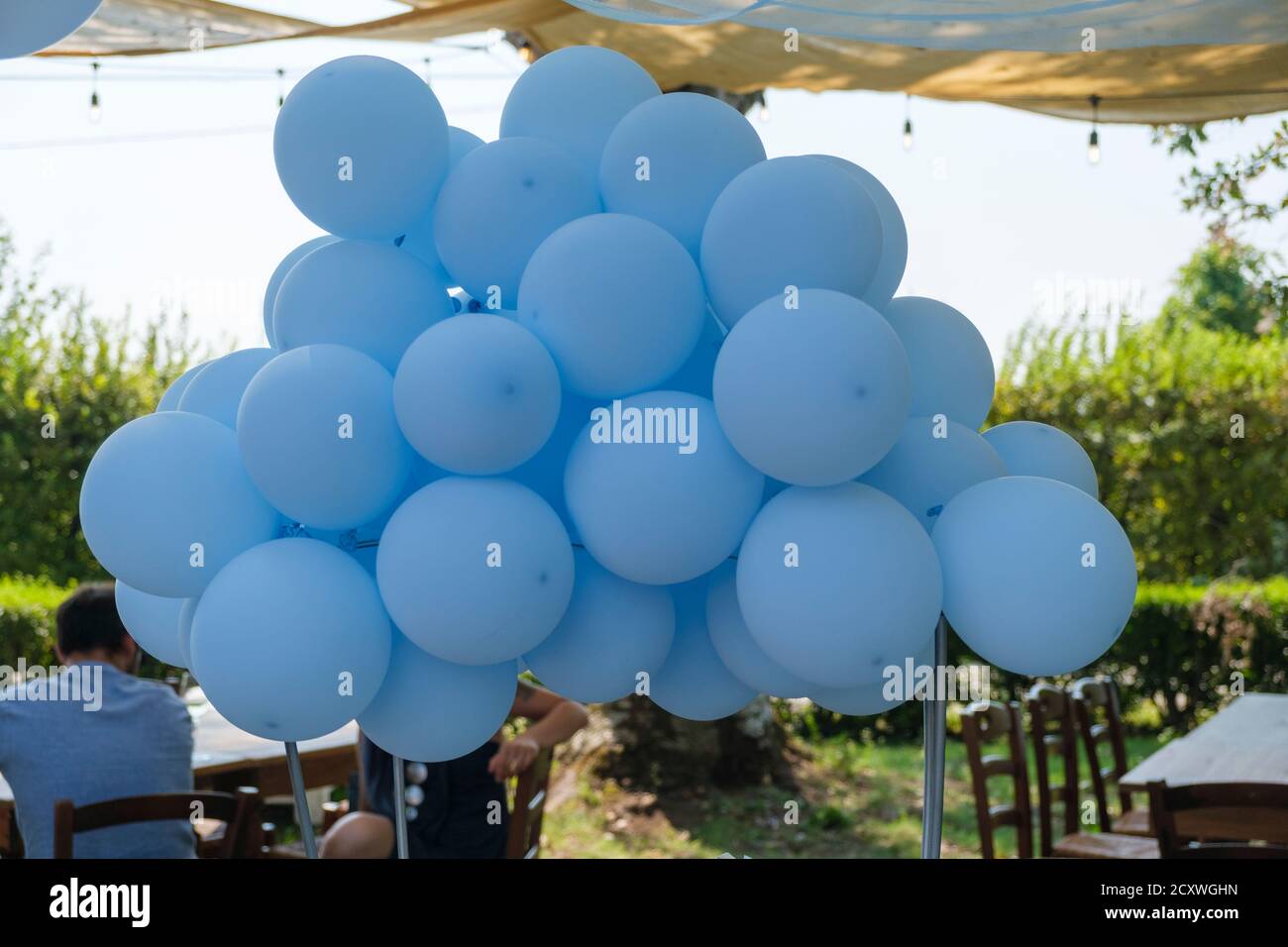 set up for baby baptism with puppets and blue balloons. High quality ...