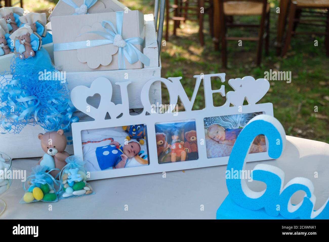 set up for baby baptism with puppets and blue balloons. High quality ...