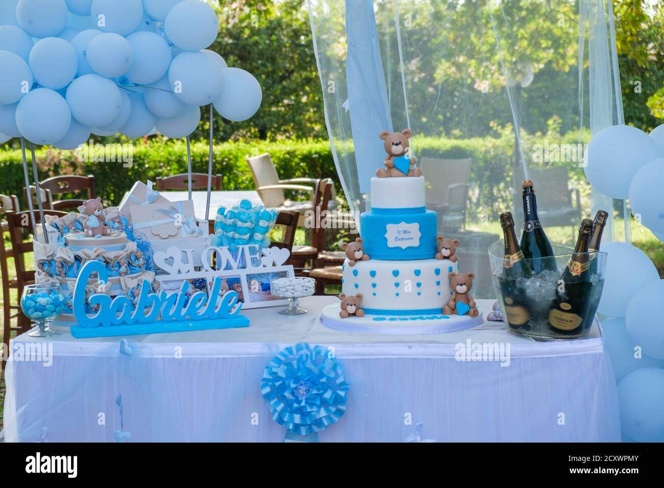 set up for baby baptism with puppets and blue balloons. High quality ...
