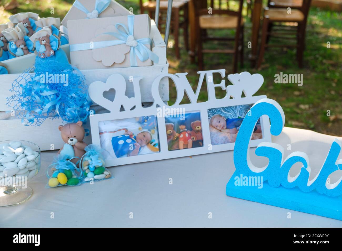 set up for baby baptism with puppets and blue balloons. High quality ...
