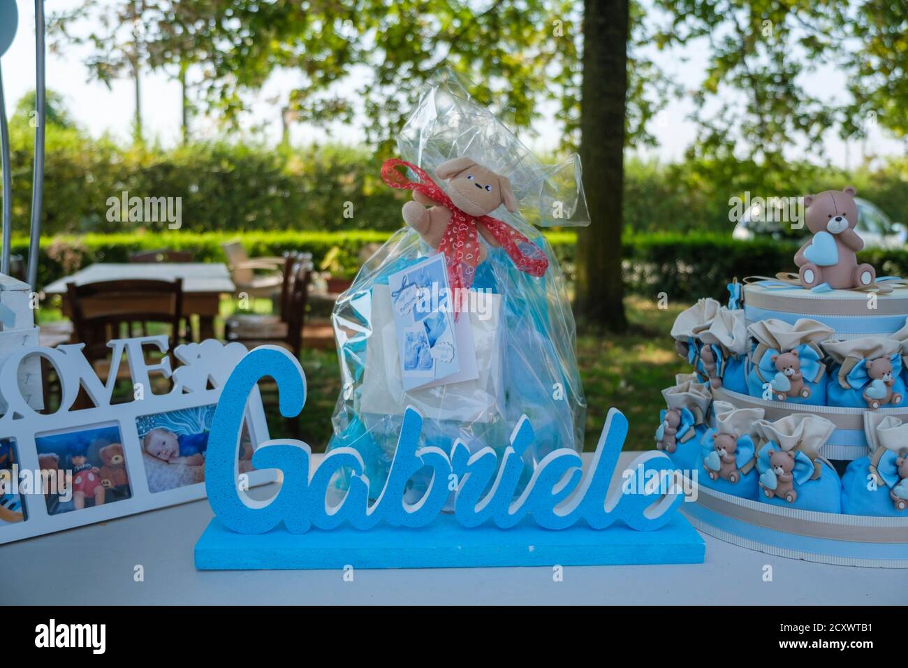 set up for baby baptism with puppets and blue balloons. High quality ...
