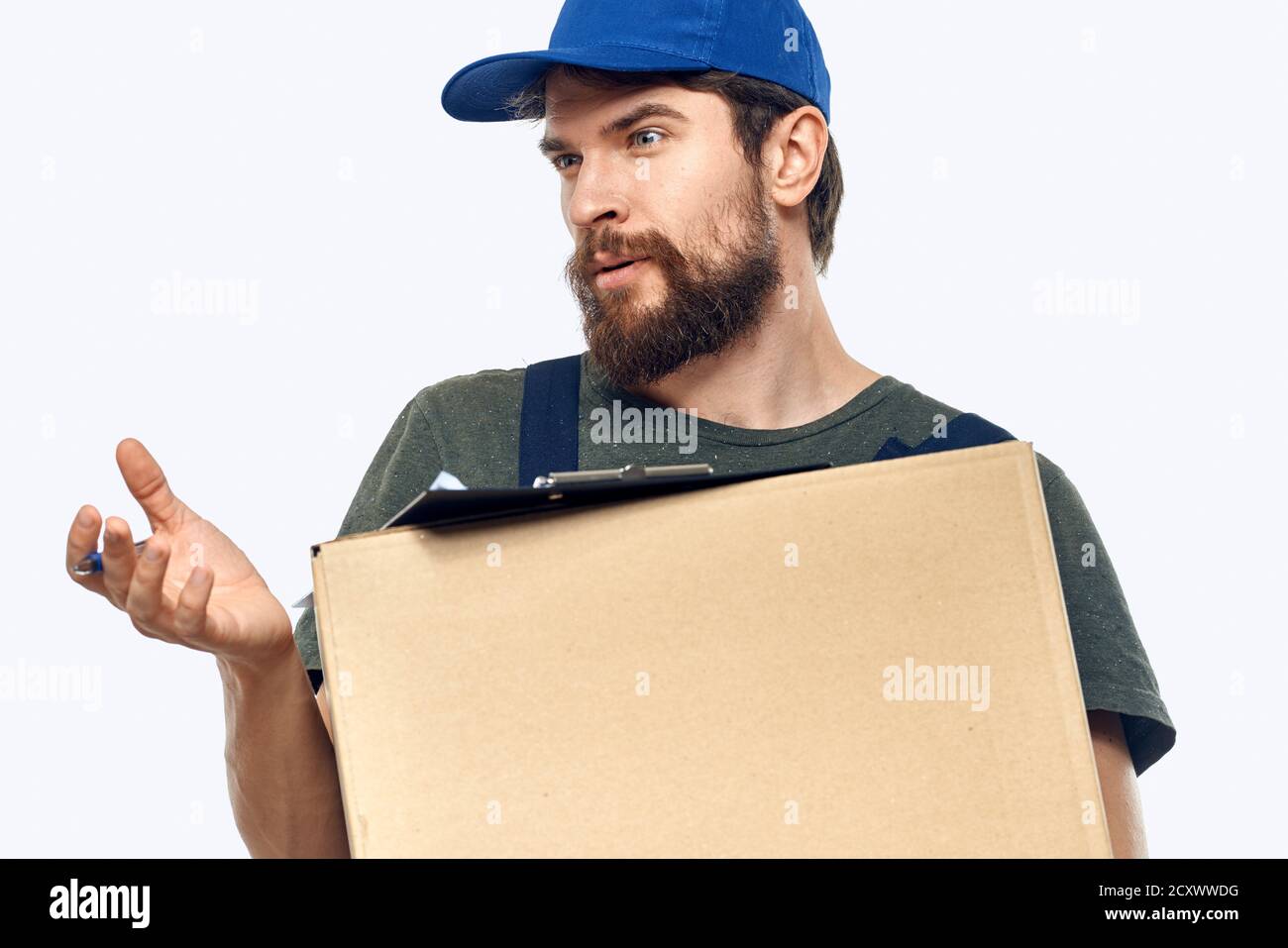 Working male courier with box in hand documents delivery service light ...