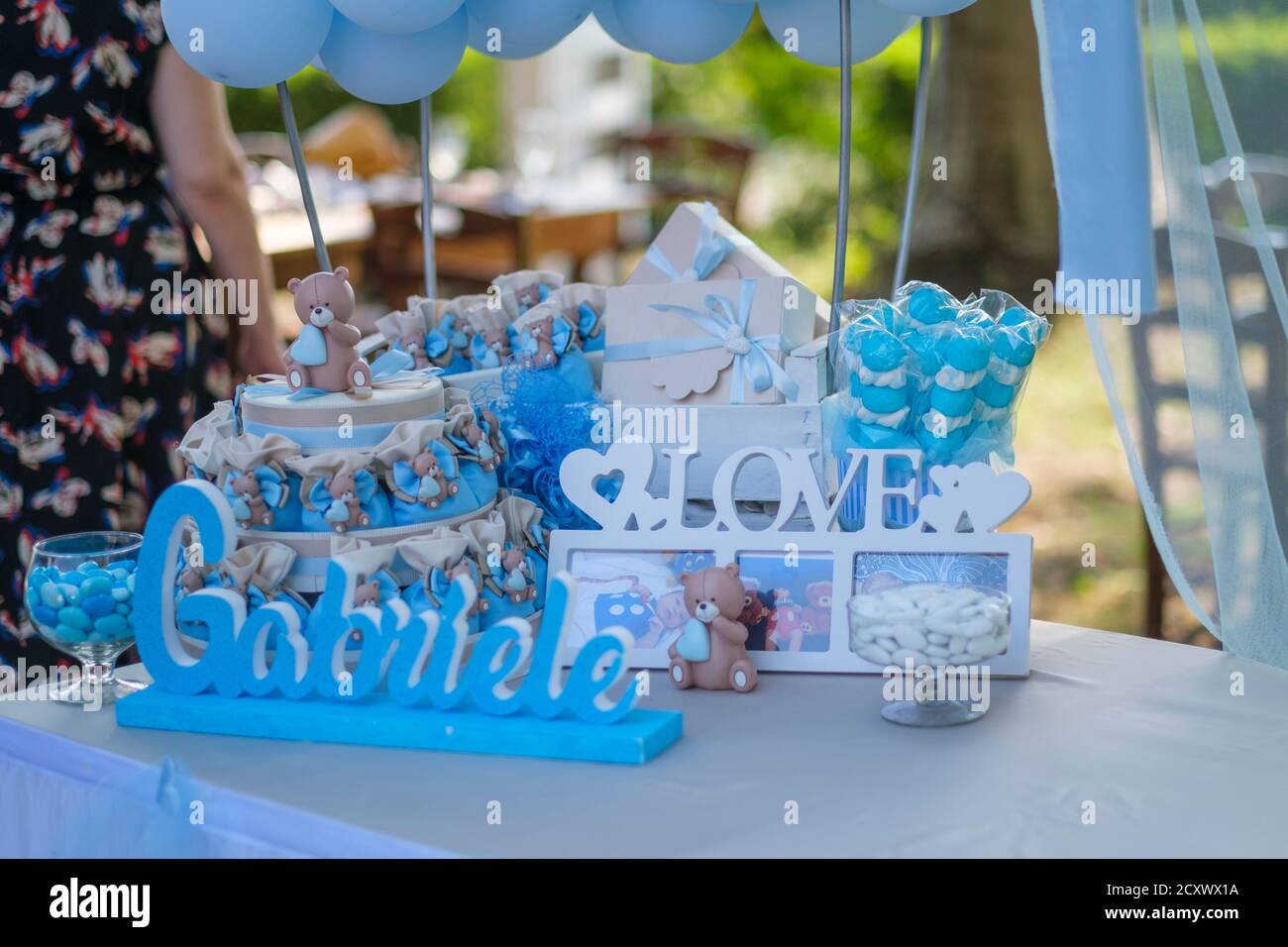 set up for baby baptism with puppets and blue balloons. High quality ...
