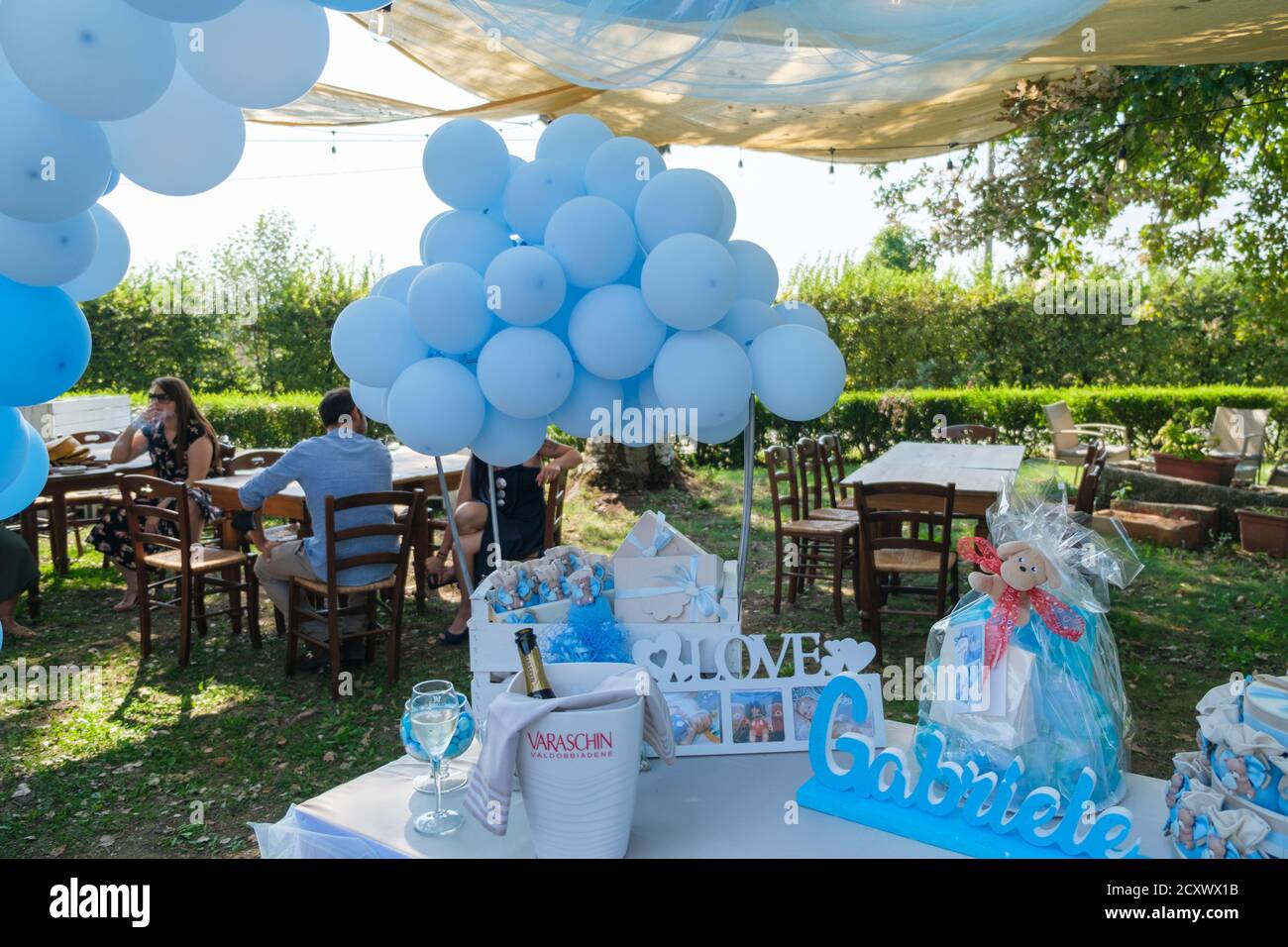 set up for baby baptism with puppets and blue balloons. High quality ...