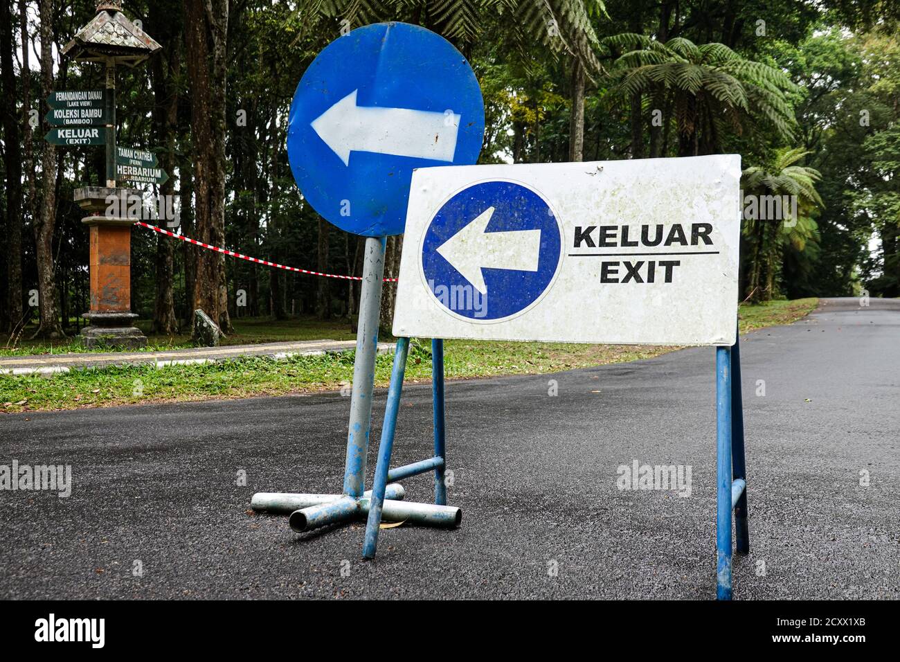 Sign toilet, stair and exit direction, blue text and red arrow on white ...