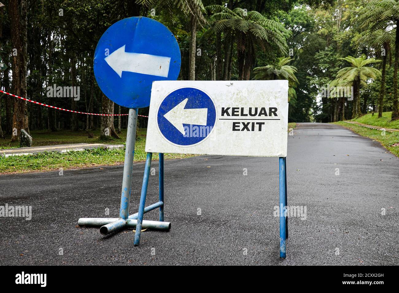 Sign toilet, stair and exit direction, blue text and red arrow on white ...